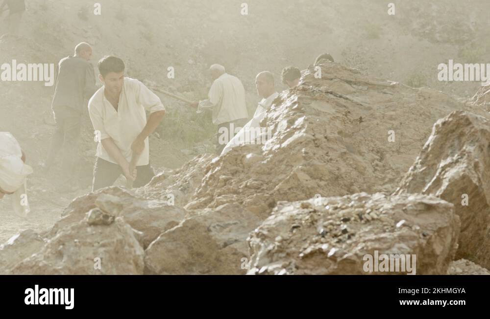 A Group Of Miners Or Gold Diggers Working . Many Workers Mining In A ...