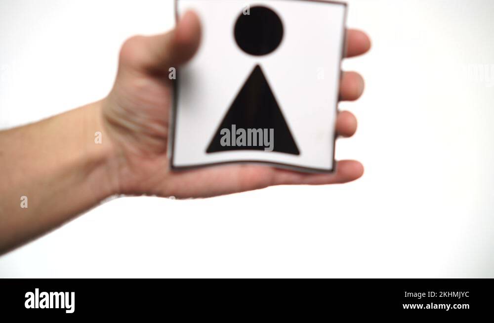 Female toilet sign isolated on white. Male hand showing restroom sign ...