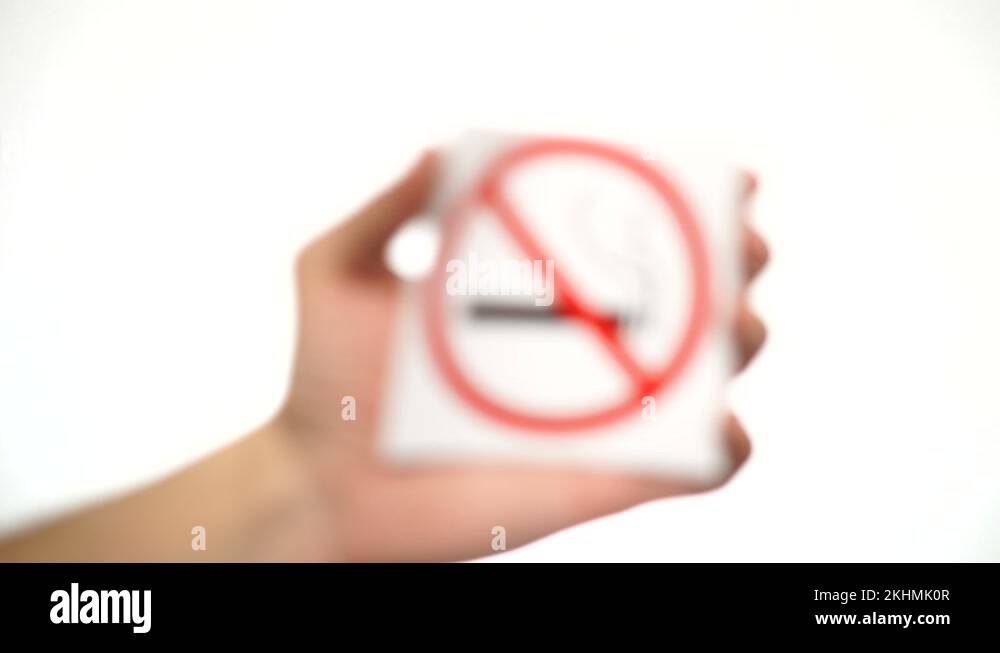No smoking allowed sign isolated. Male hand holding no smoking sign ...