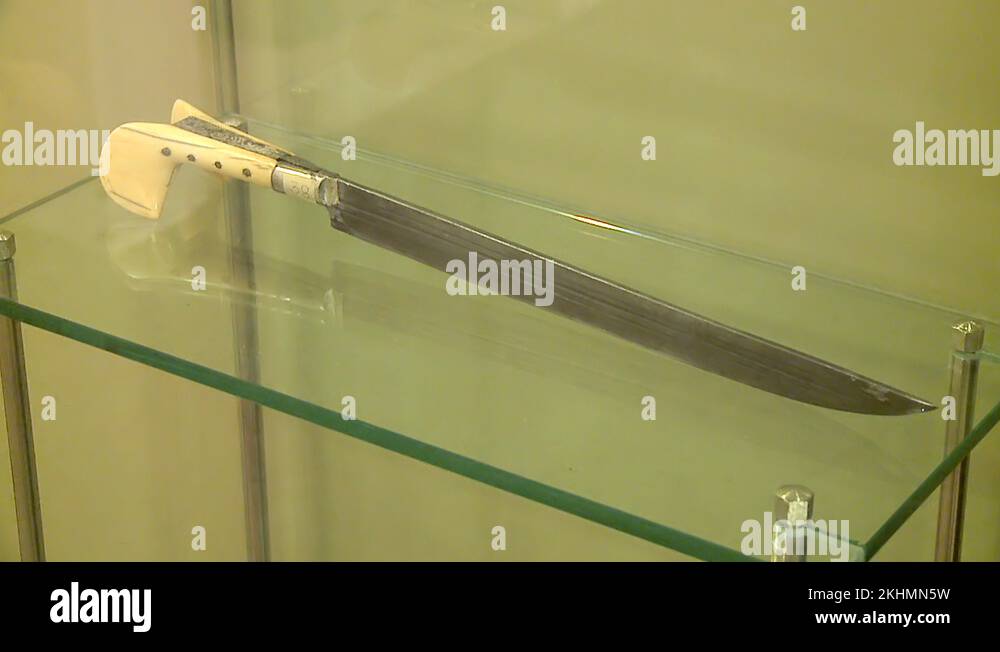 The old saber in the showcase. Sword in a museum exhibit or collectors ...