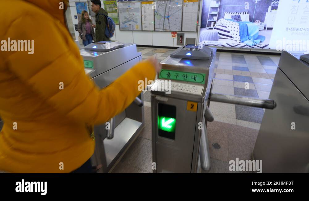 Woman pay using smart ticket, exit through metro station gate Stock ...