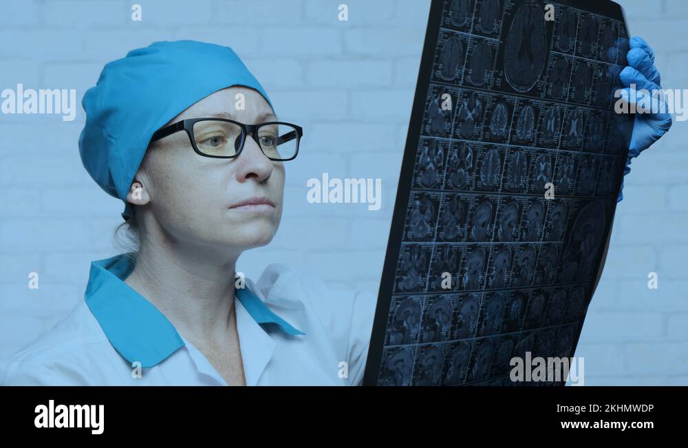 Portrait of female doctor examining MRI images of human brain Stock ...