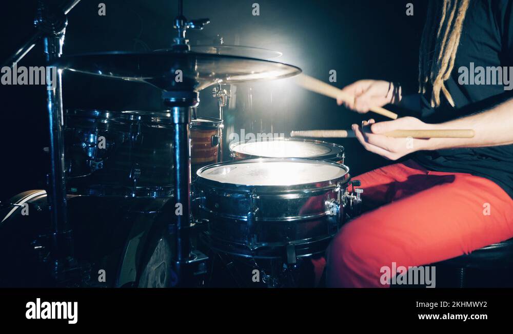 Side view of a drum set getting hit while rehearsing Stock Video ...