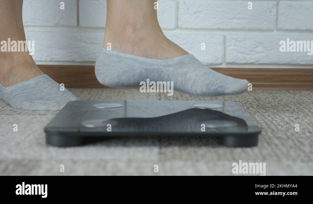 Woman on the scales Stock Videos & Footage - HD and 4K Video Clips - Alamy