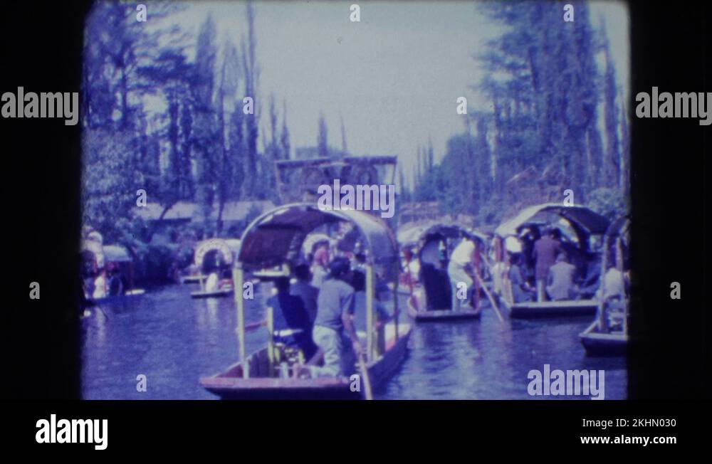 MEXICO CITY-1962: A Large Group Of People Rowing Their Boats Along The ...
