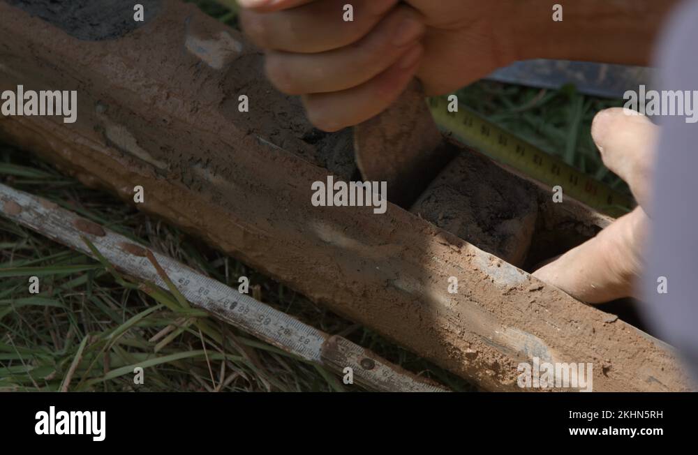 Geologist taking out clay core samples from drill pipe Stock Video ...