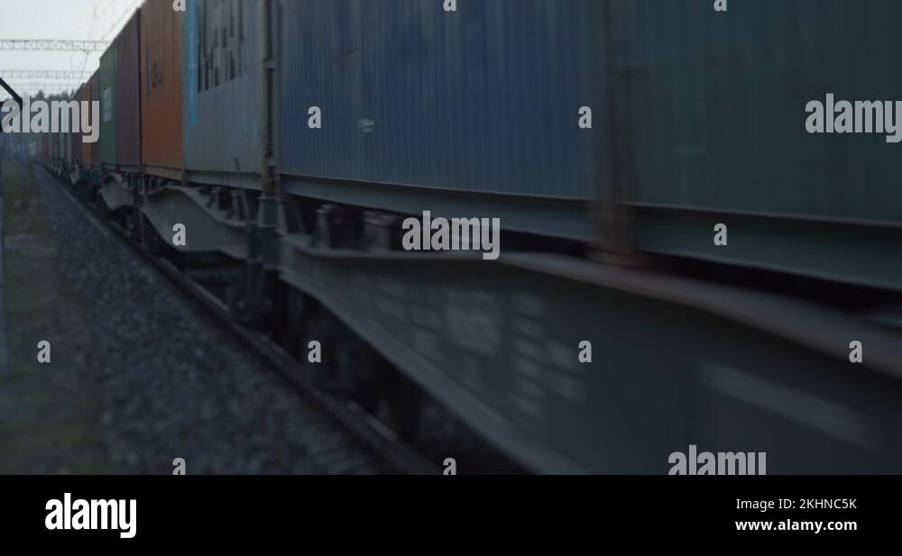 Freight train with cargo containers high speed passing Stock Video ...