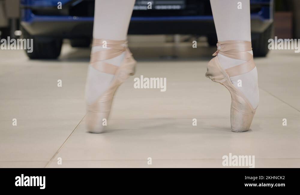 Close-up of ballet dancer's feet, professional ballerina balancing on ...