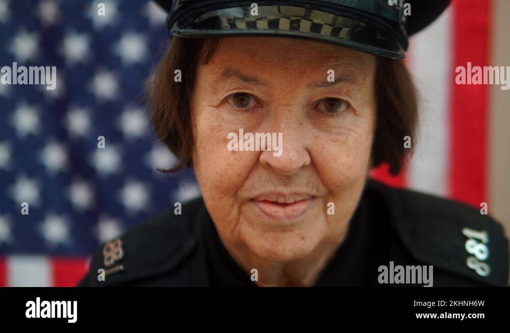 Portrait Of Brave Female American Cop, Mature Police Officer, US Flag ...