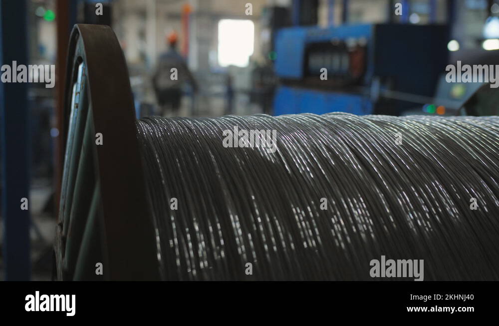 Aluminum wire pulley rolling. Winding the aluminum cable onto the reel ...