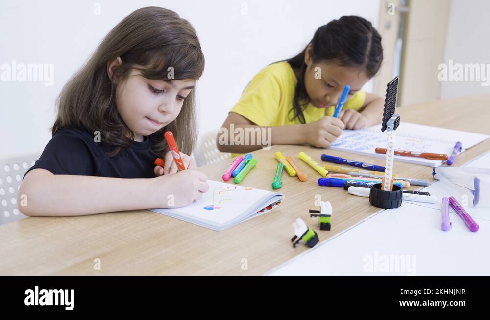 Two school girls writing Stock Videos & Footage - HD and 4K Video Clips ...