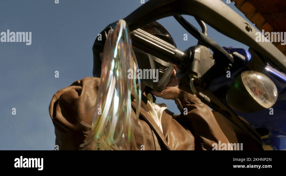 Woman on motorcycle taking off helmet Stock Videos & Footage - HD and ...