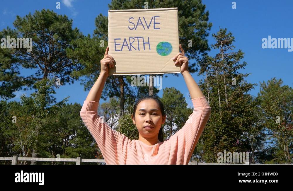 Woman hold"Save Earth"Poster show a sign protest against plastic ...