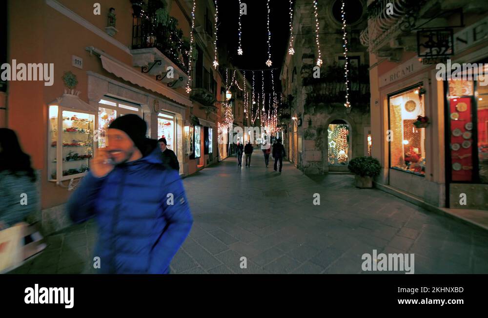 The main street of Taormina in Sicily at night with Christmas ...