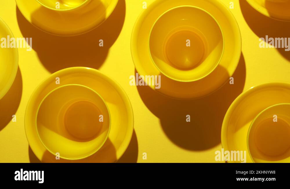 yellow plastic bowls are placed in layers for background texture Stock ...