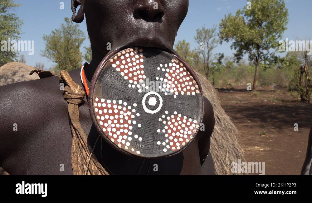 Africa traditional customs culture, clay discs of tribal Mursi woman ...