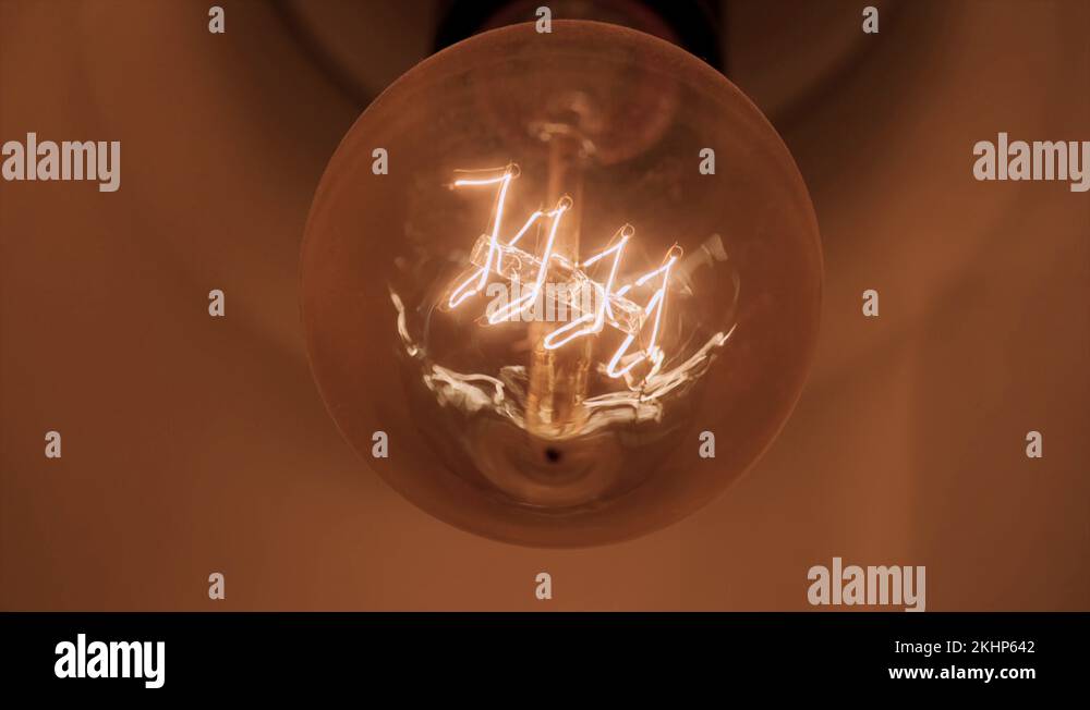 Classic Edison Light Bulb being switched on and off in slow motion ...