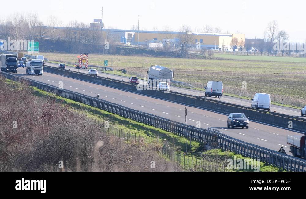 Heavy but smooth traffic of cars and trucks on an Italian highway Stock ...