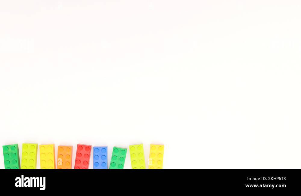 Bricks toys appear on bottom and top of white background - Stop motion ...