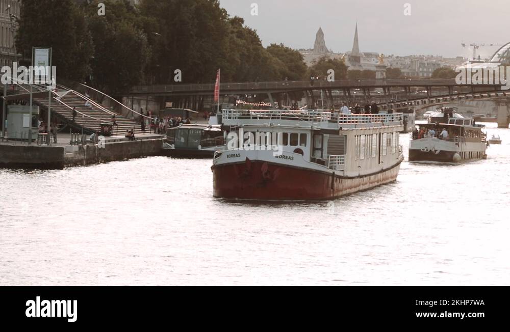 cloudy day The city of Paris is a famous ferry on the river Seine ...