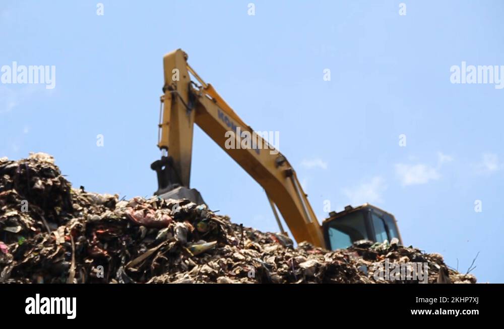 a pile of garbage from the surrounding community becomes a mountain of ...