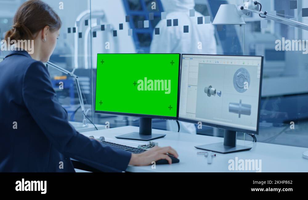 Female Engineer Working on PC, Two Monitor Screens Show Chroma Key ...
