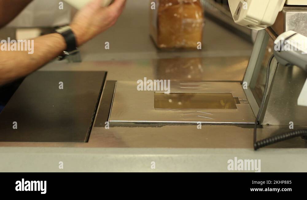 Scanning Groceries barcodes at the Cash register in the supermarket ...