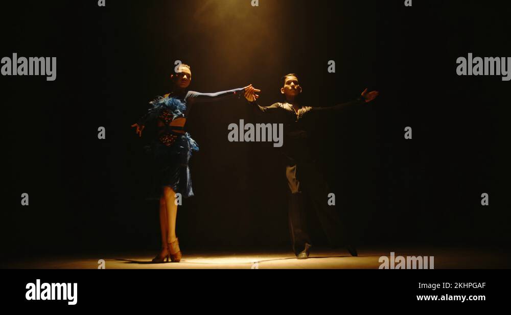 Two asian kids performing a ballroom dance on stage, fulffilling ...