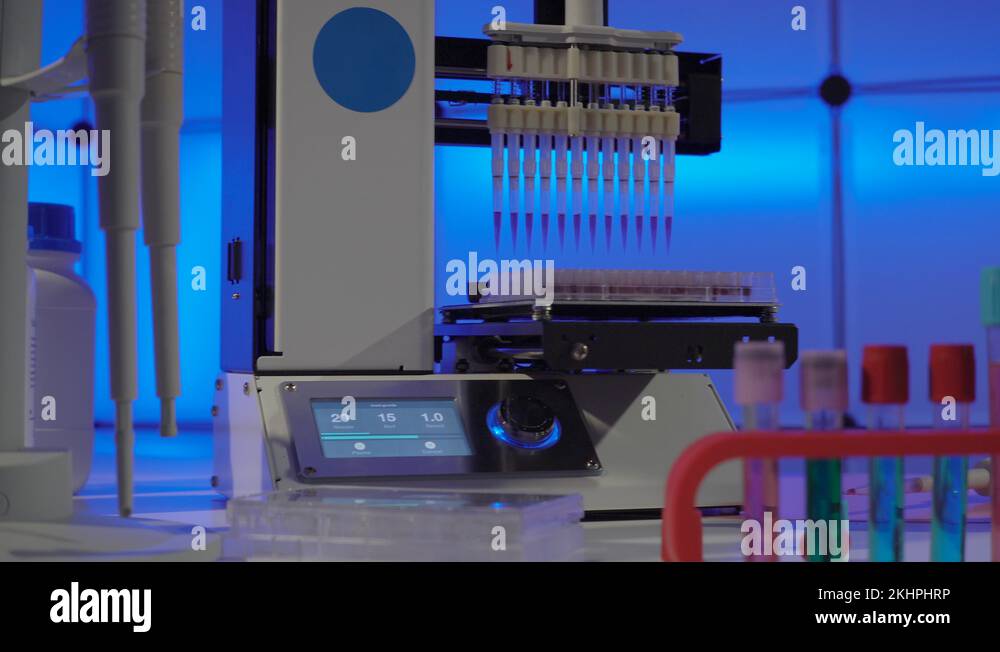 Young woman use Automated DNA Processor real-time PCR cycler. PCR ...