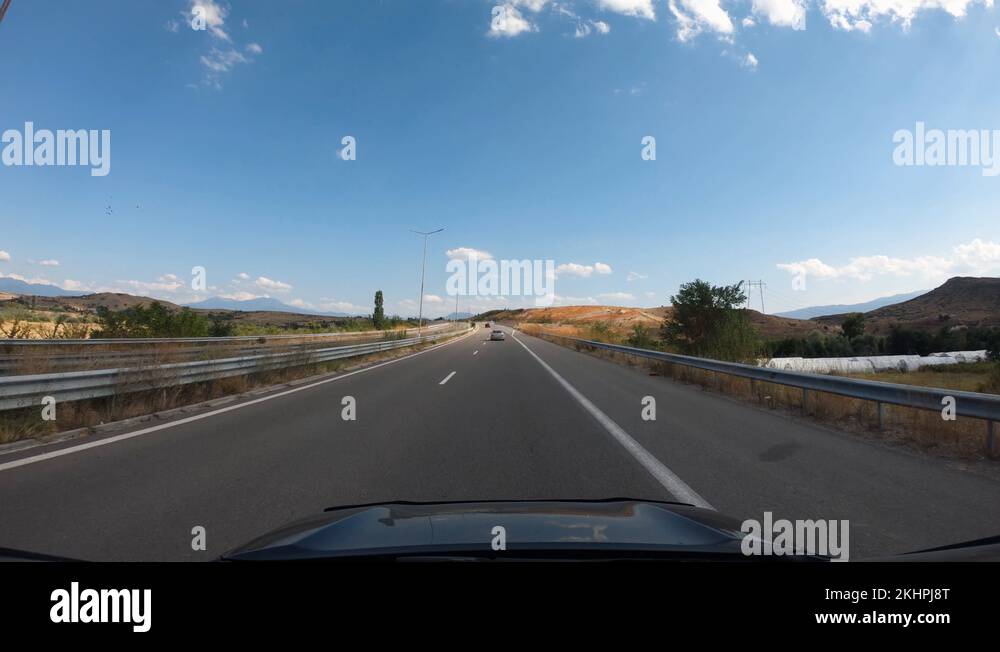 Road trip on Europe, first-person view of a moving car on a highway ...