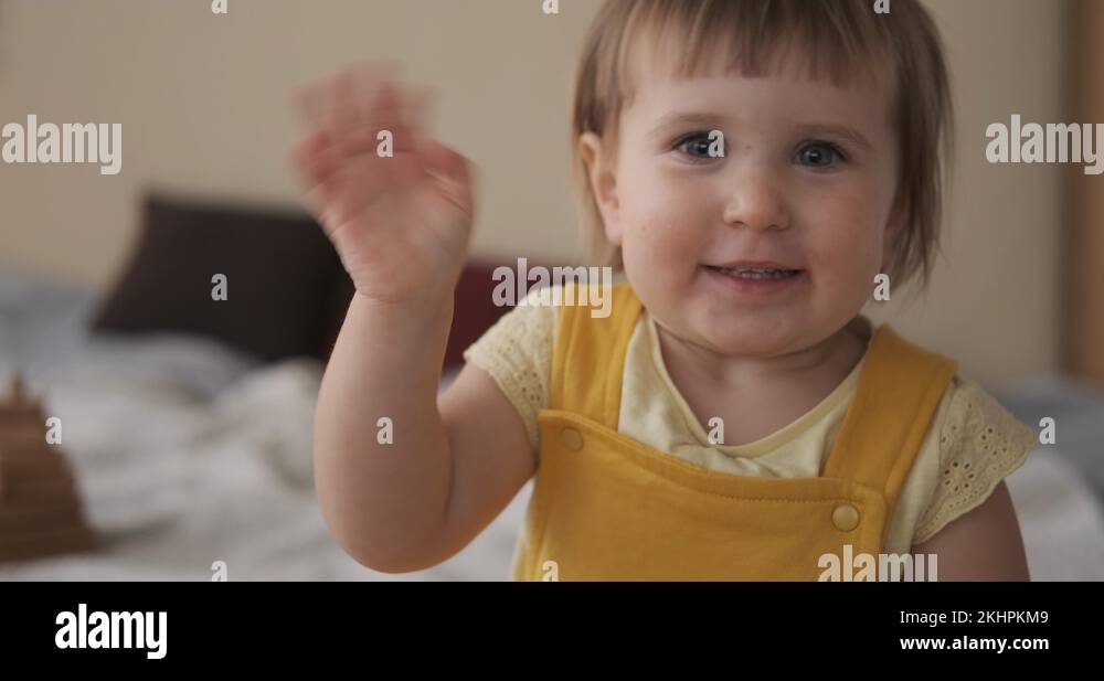 Baby waving hand Stock Videos & Footage - HD and 4K Video Clips - Alamy