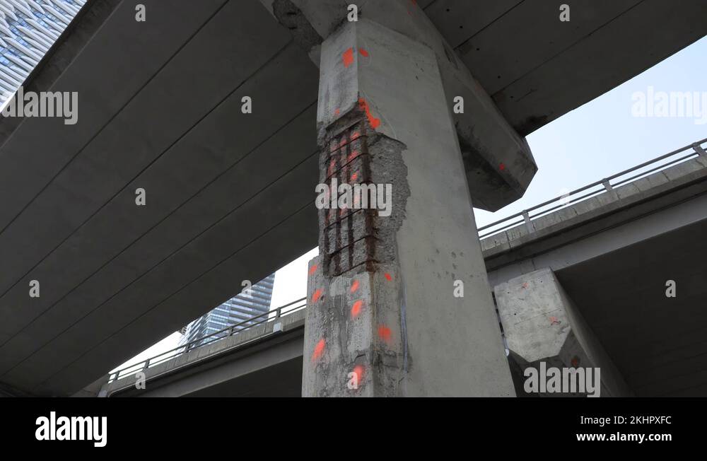 Crumbling and decaying city highway and bridge concrete infrastructure ...