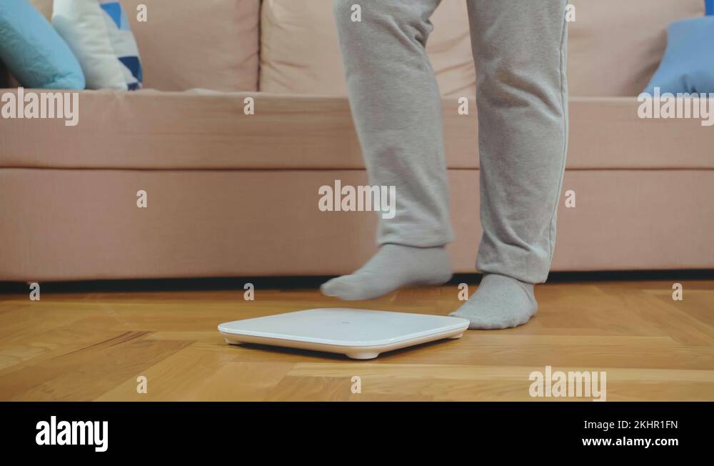 Overweight man standing on scales Stock Videos & Footage - HD and 4K ...