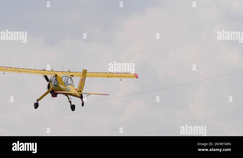 Glider plane in tow of an motorplane Stock Video Footage - Alamy