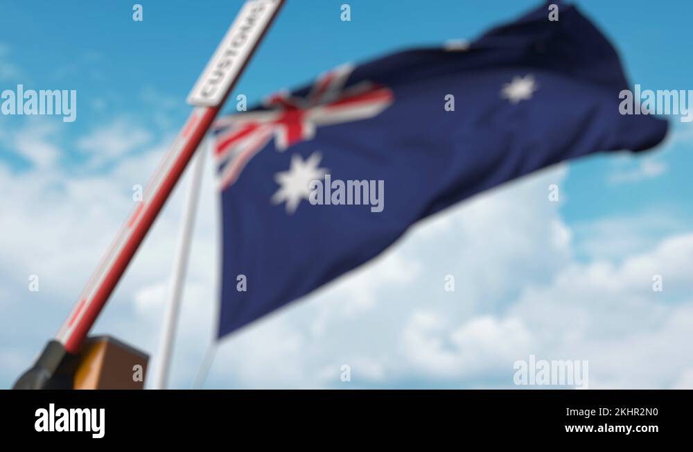 Closed boom gate with CUSTOMS sign on the Australian flag background ...