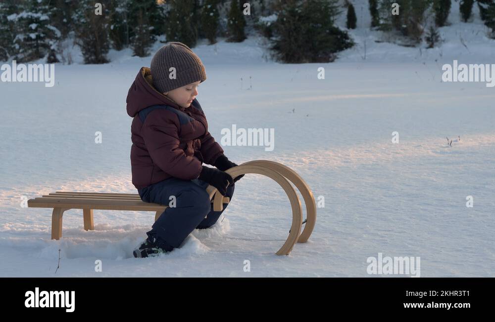 Boy on sled sledding Stock Videos & Footage - HD and 4K Video Clips - Alamy