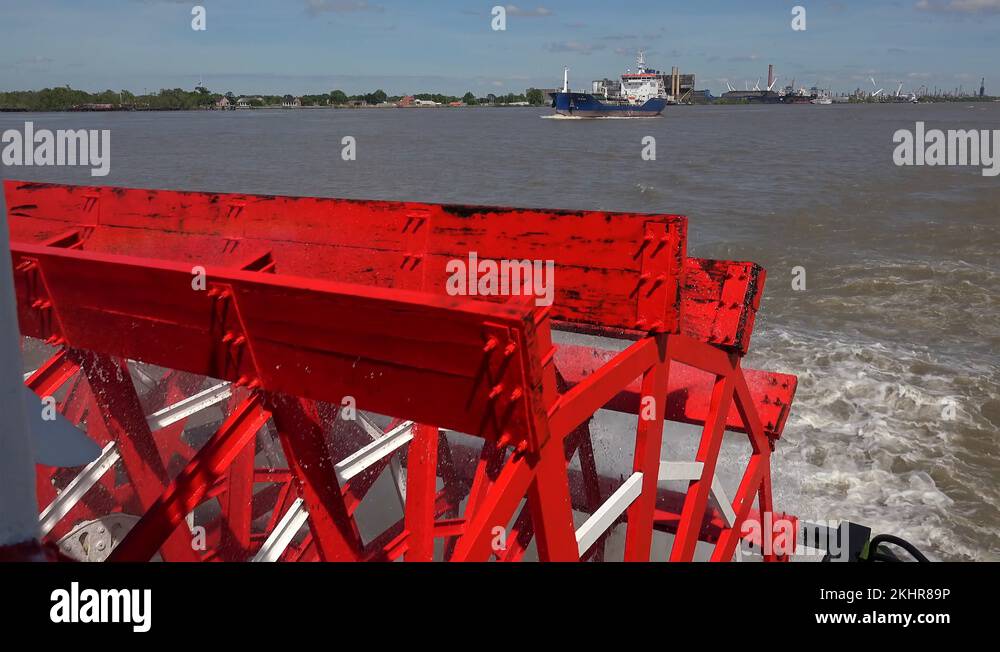 Working paddlewheel of Natchez steamboat with the Mississippi river ...