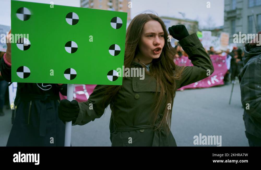 Girl go against crowd people. Scream and wave hand. Activism street ...