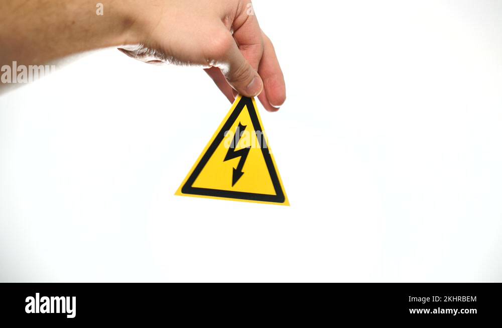 Hand showing warning sign "high voltage " isolated on white Stock Video ...