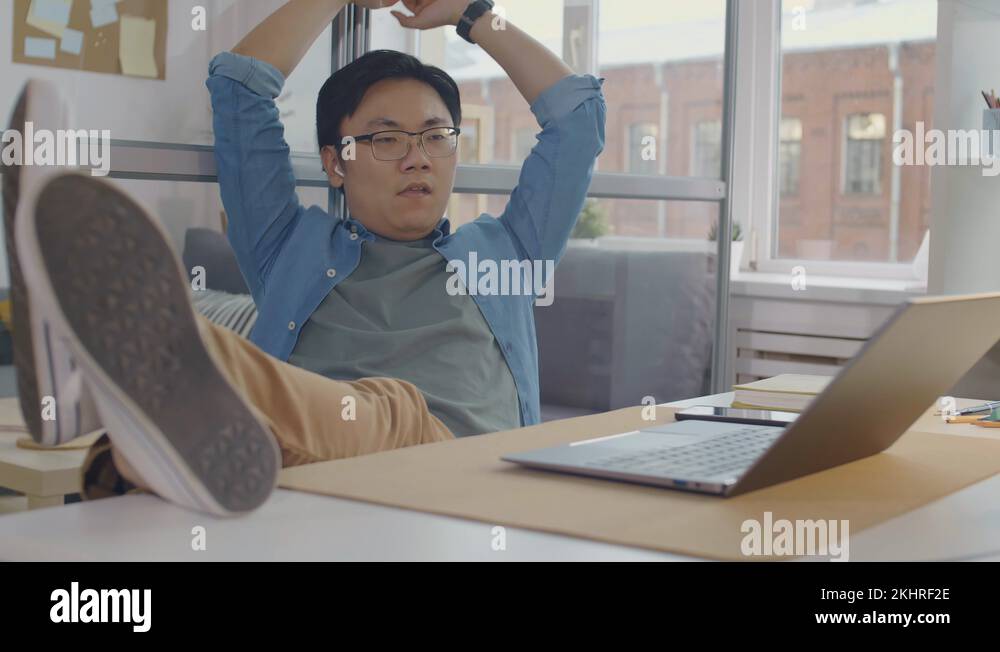 Man sitting desk feet up Stock Videos & Footage - HD and 4K Video Clips ...