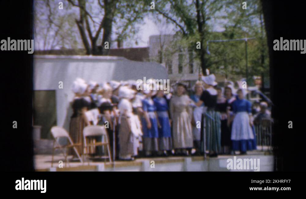 IOWA USA-1959: Young Girls In Traditional Dress Raise Their Arms Or ...
