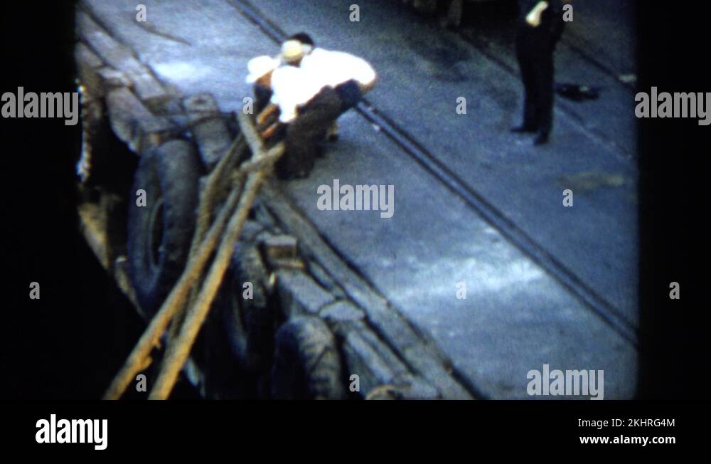 VENEZUELA-1959: Men On Quay Pulling A Rope Splash In The Water Stock ...