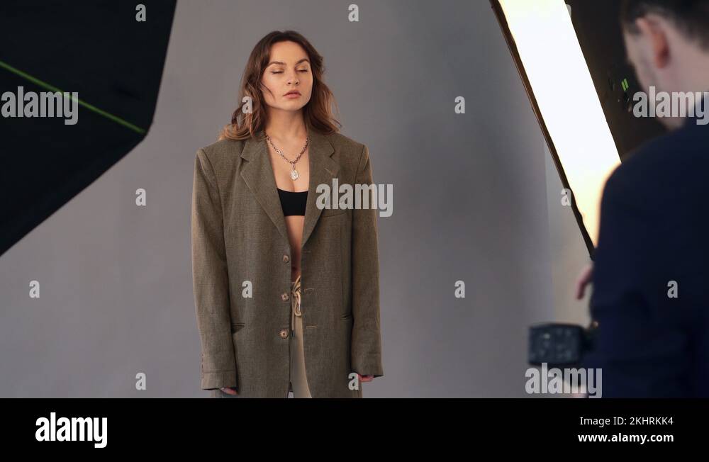 A female model poses for a male photographer Stock Video Footage - Alamy