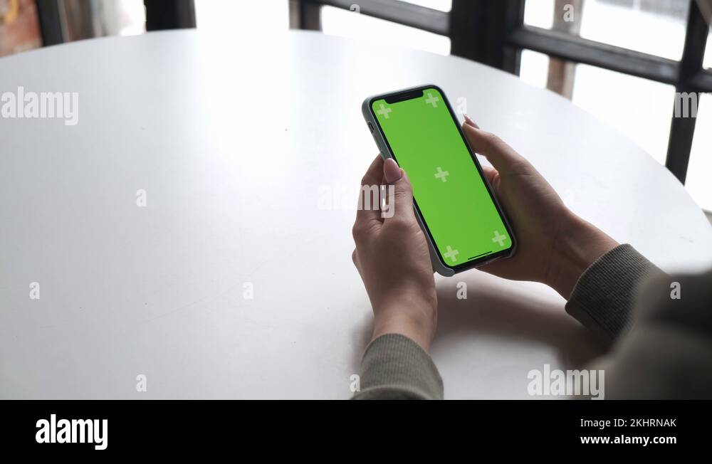 Mobile phone with green screen close up. Chroma key on the cell phone ...