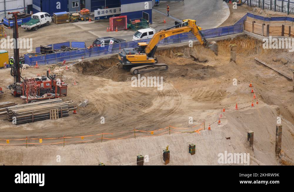 Excavator dig and remove ground around piles, load to dump lorry, time ...