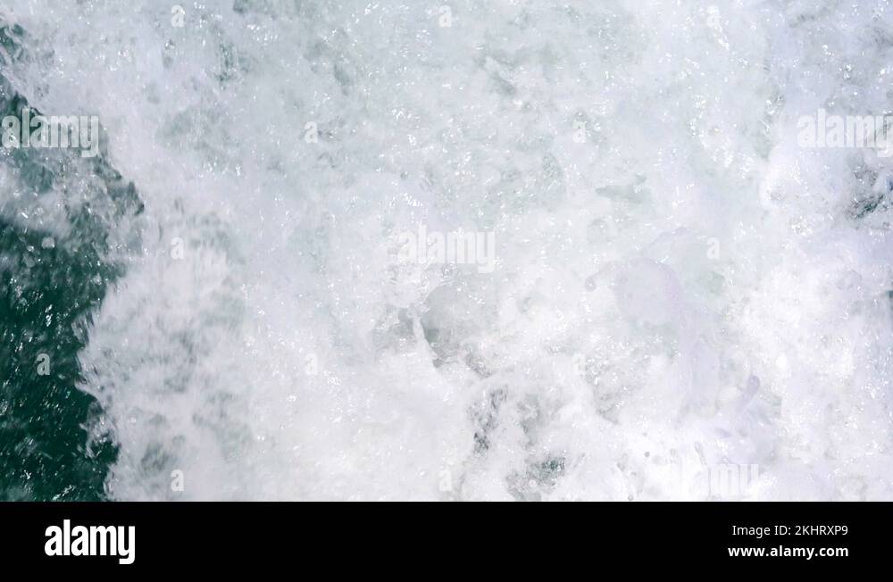 Blue Ocean sea water with wake foam of prop wash in slow motion Stock ...