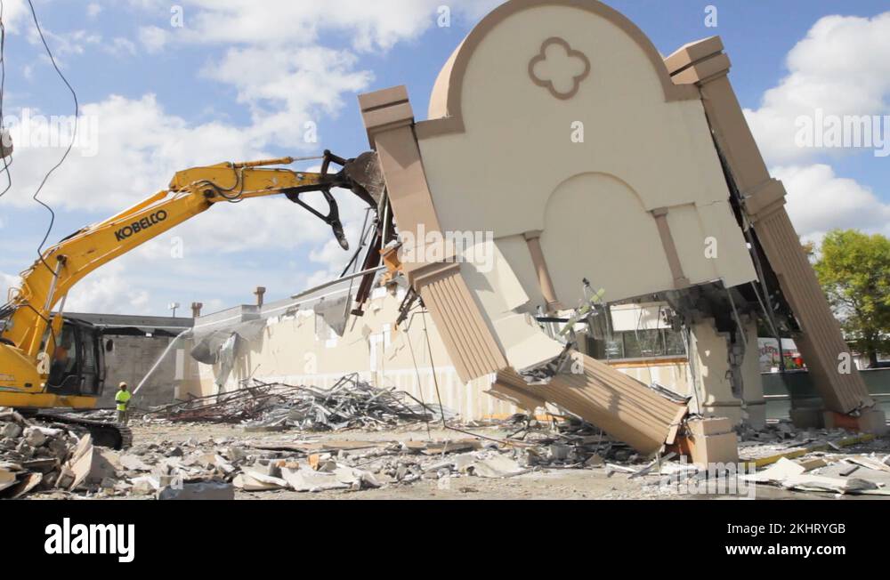 Front of building collapses gets destroyed by heavy equipment Stock ...