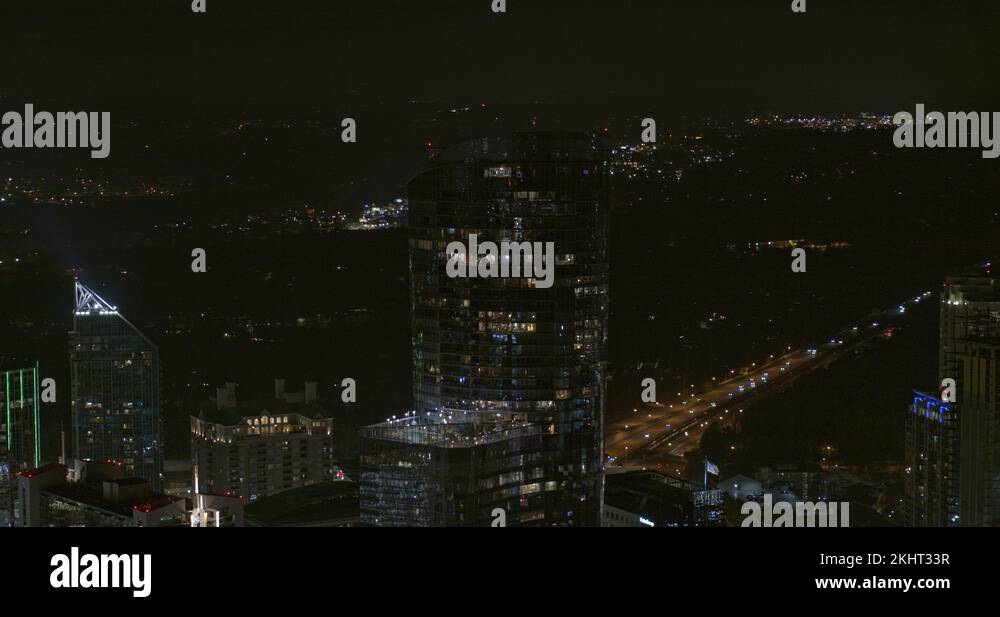 Atlanta Aerial v500 Slow, dark panning detail view of downtown Buckhead ...