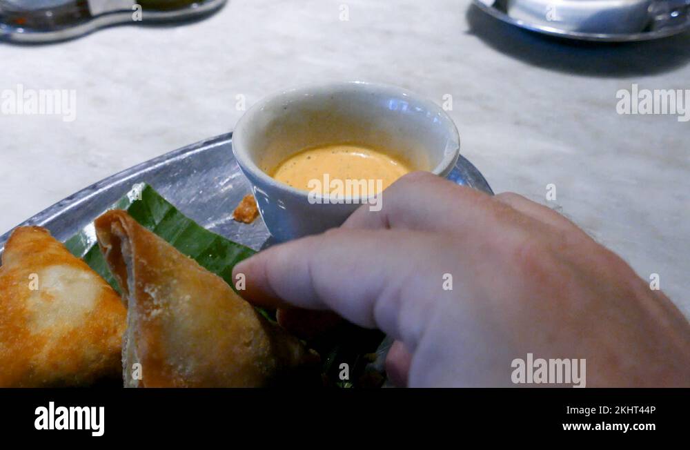 Eating samosas Stock Videos & Footage - HD and 4K Video Clips - Alamy