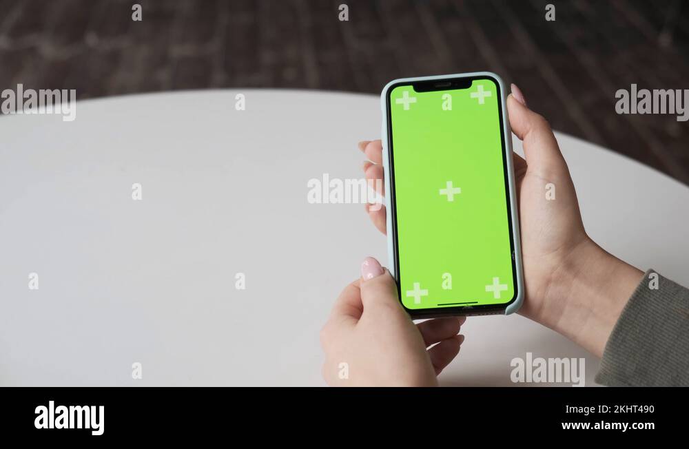 Mobile phone with green screen close up. Chroma key on the cell phone ...